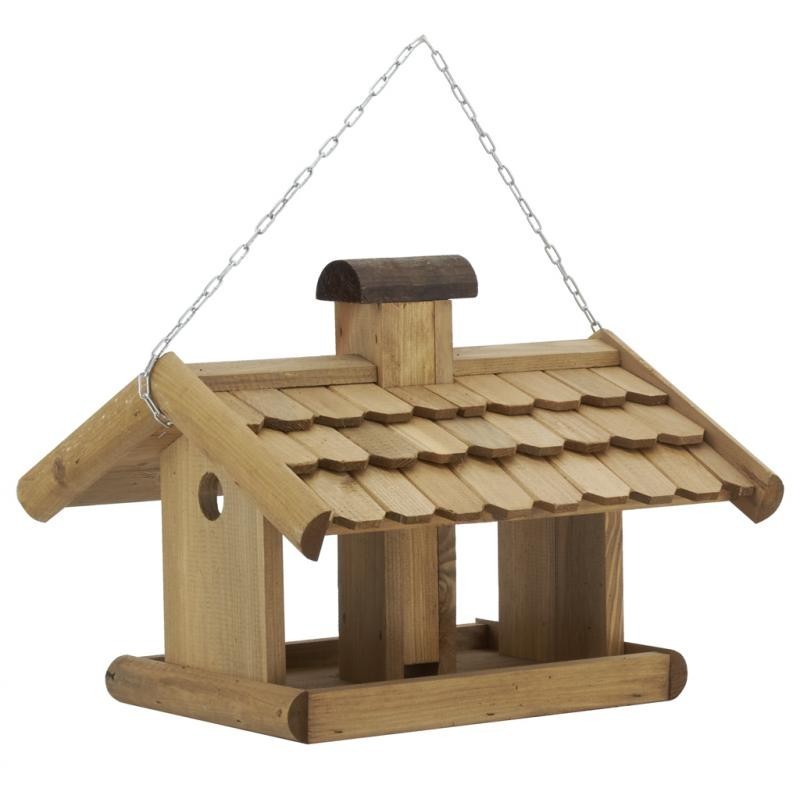 Hanging wooden bird feeders in the garden